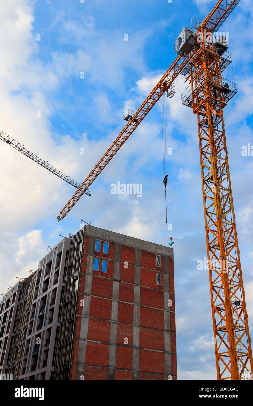 Building crane and house under construction Stock Photo - Alamy