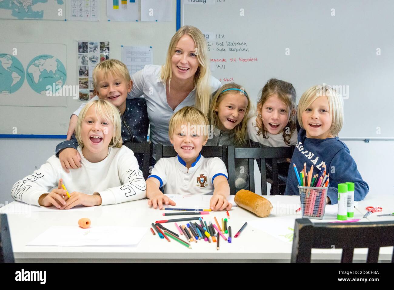Teacher and children in classroom Stock Photo - Alamy