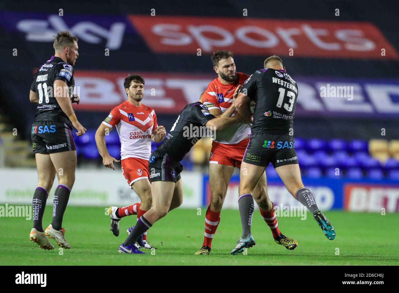 Alex Walmsley (8) of St Helens is stopped by Joe Westerman (13) of ...