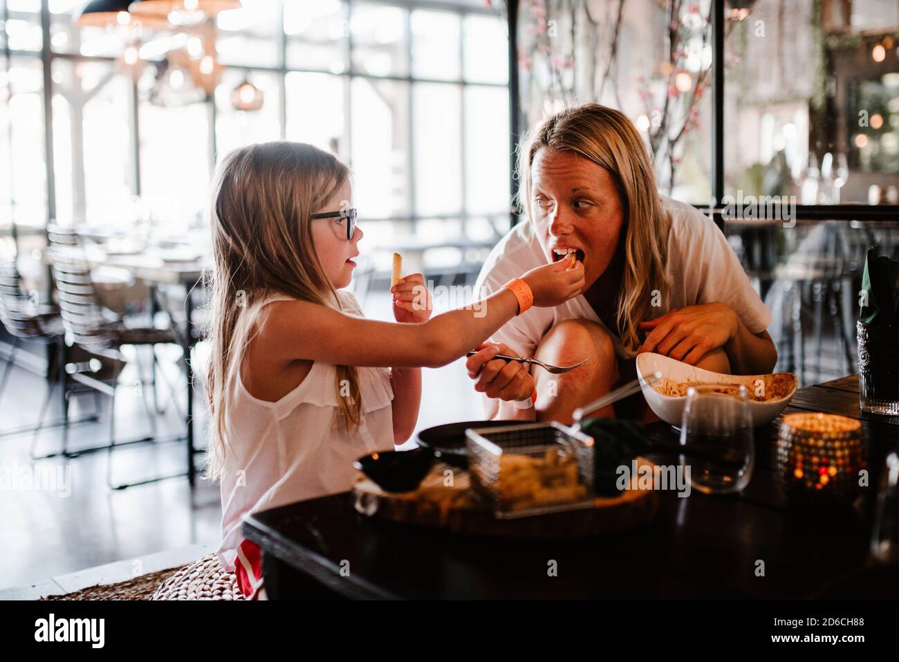 Mother and daughter in restaurant Stock Photo - Alamy