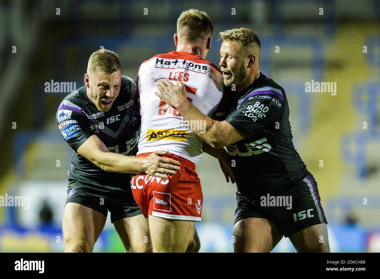 Wakefield Trinity's Chris Green and Joe Westerman tackle Matty Lees of ...