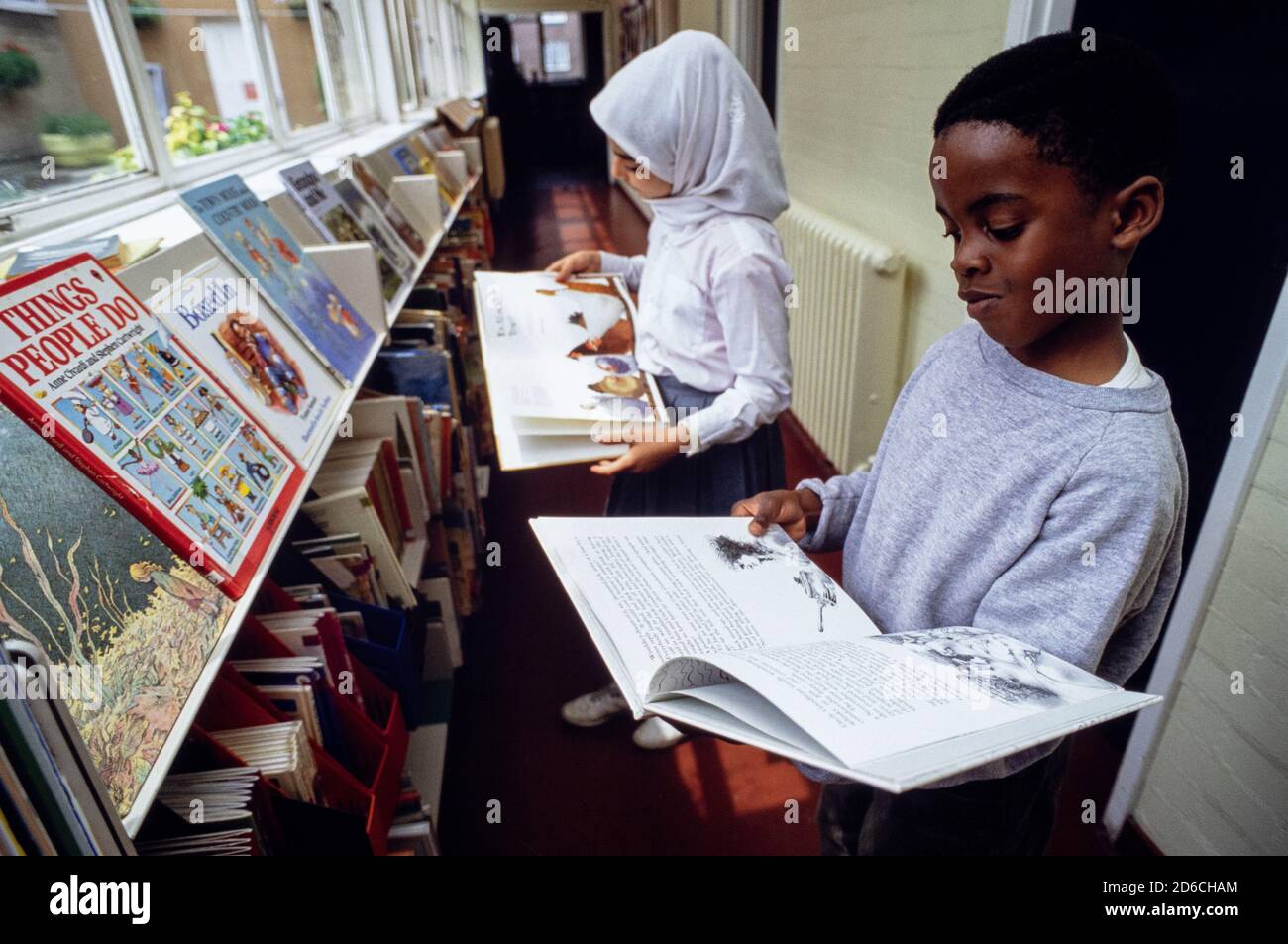 Pupils browse the books in the school’s library at Christchurch CofE ...