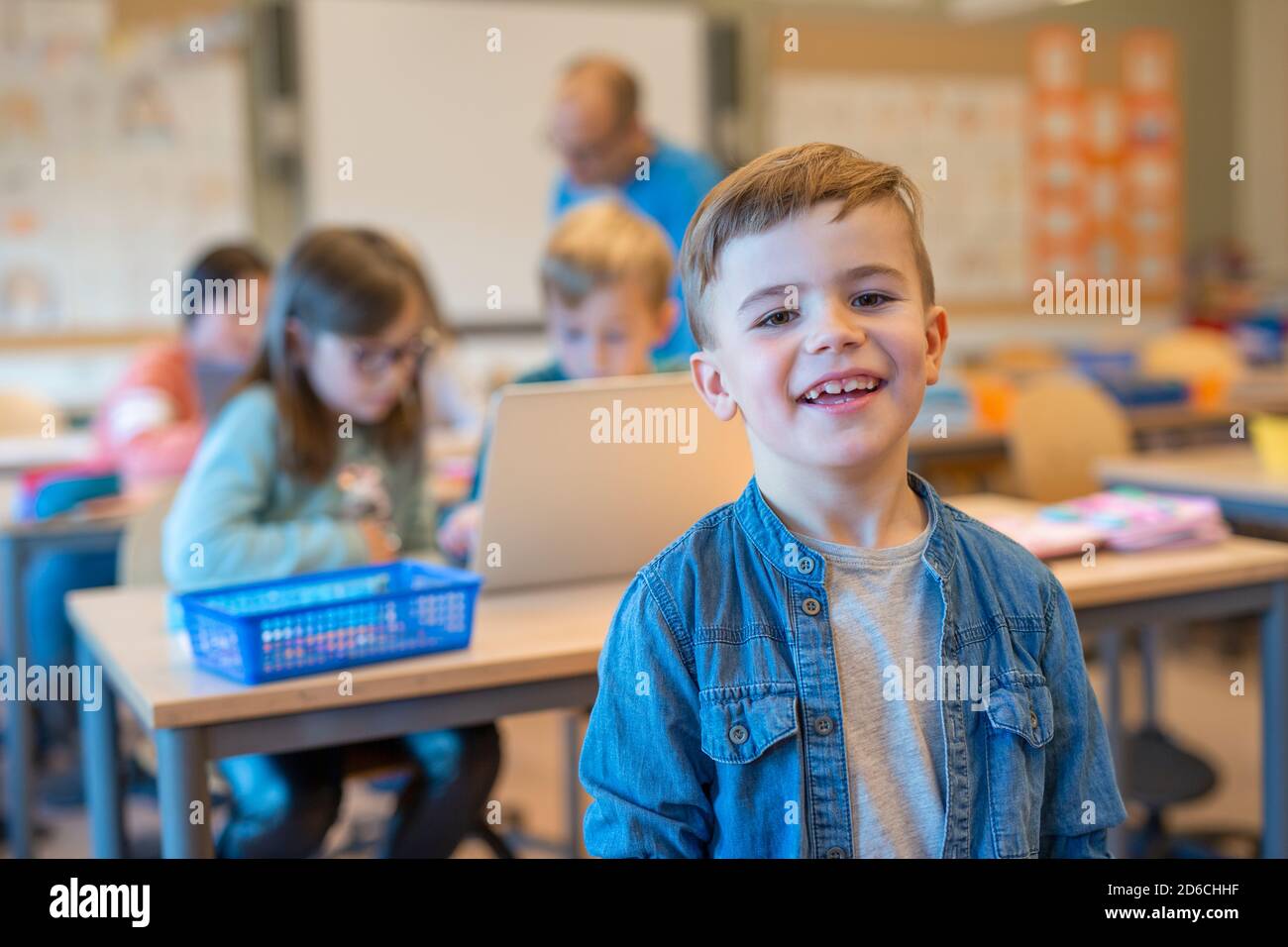 Smiling boy in classroom Stock Photo - Alamy