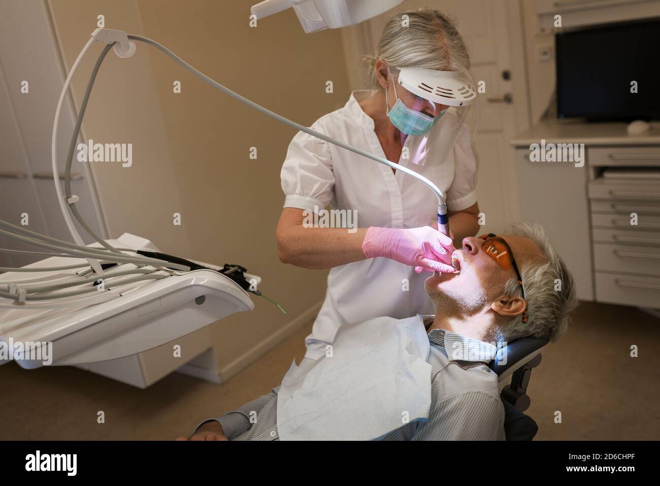 Dentist examining patients teeth Stock Photo - Alamy