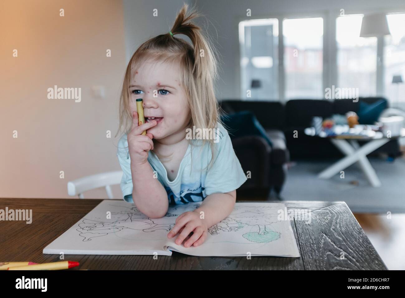 Smiling girl coloring Stock Photo - Alamy