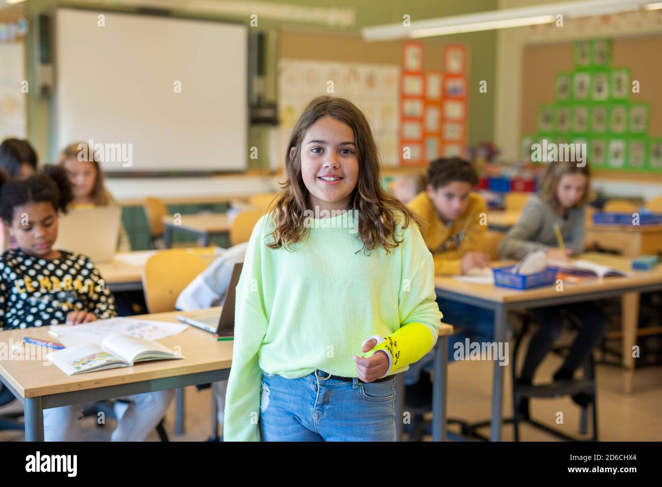 Girl in classroom Stock Photo - Alamy