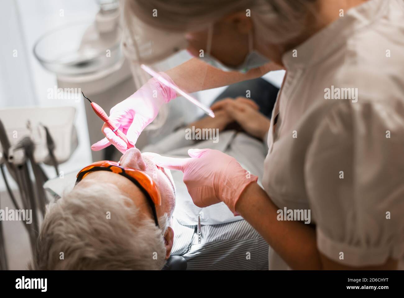 Dentist examining patients teeth Stock Photo - Alamy