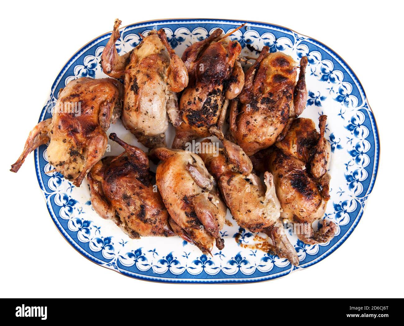 Big plate full of freshly roasted quails isolated on white Stock Photo ...