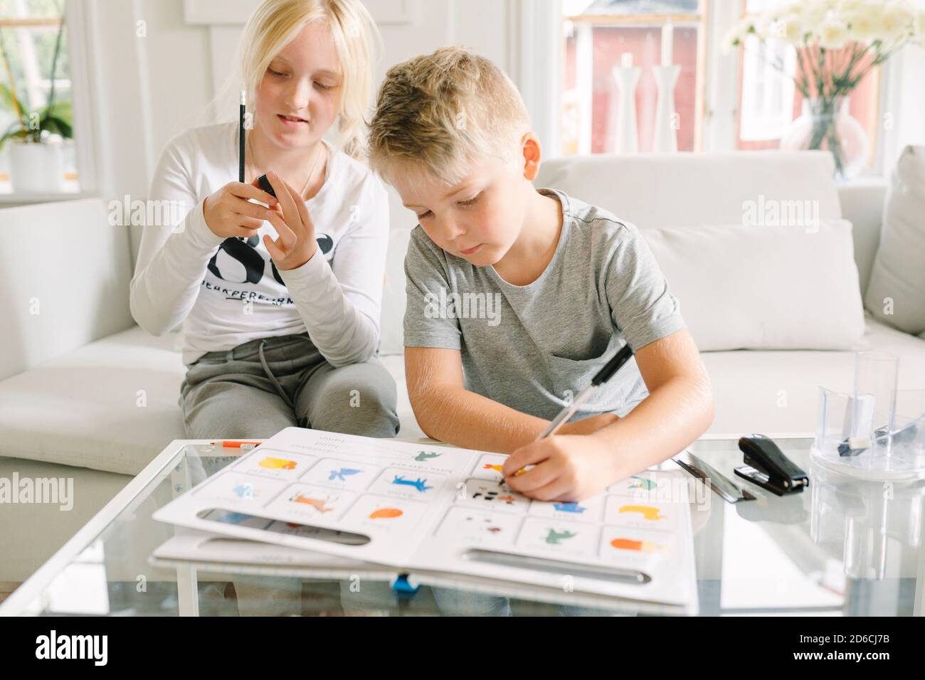 Brother and sister writing hi-res stock photography and images - Alamy