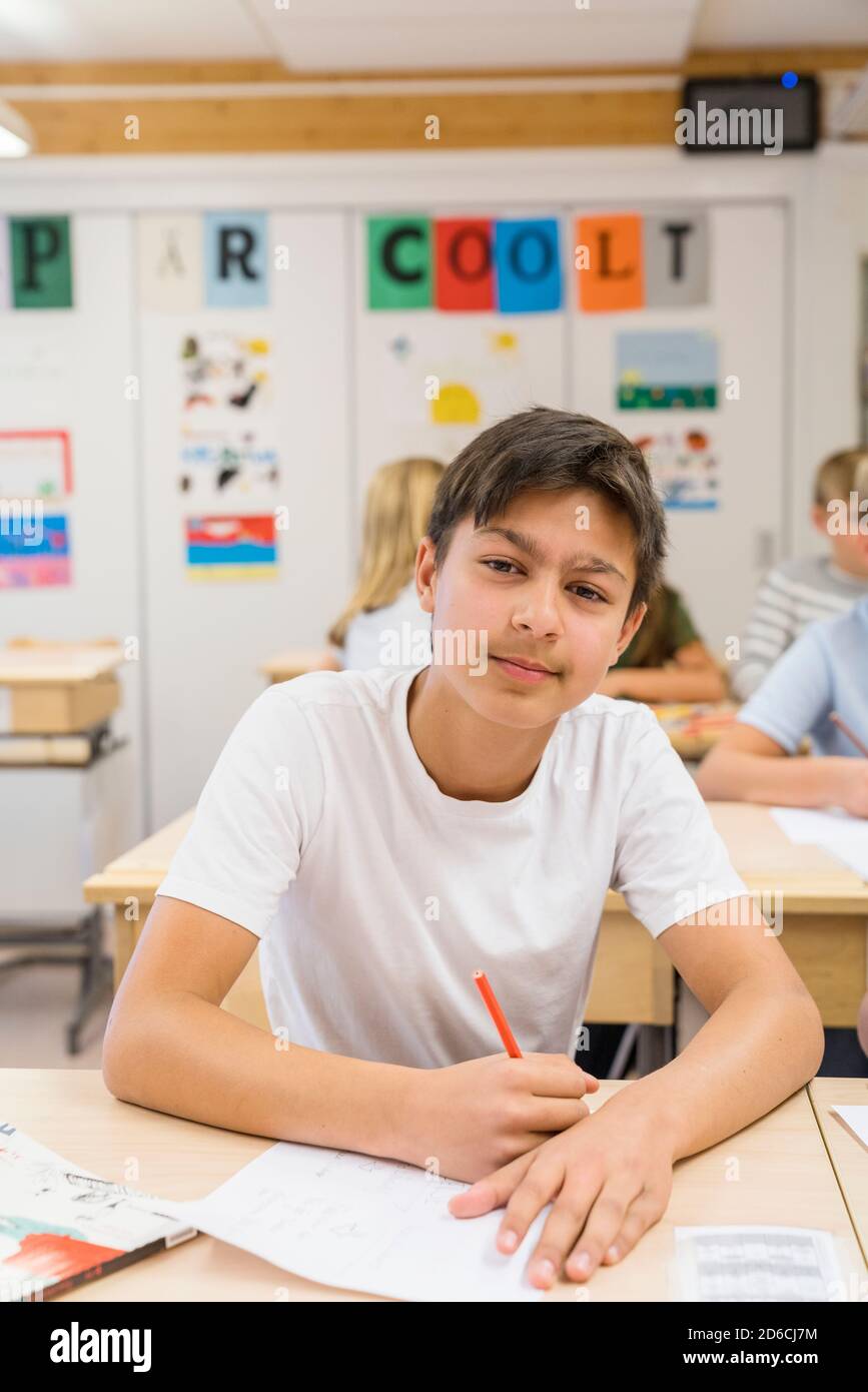 Boy in classroom Stock Photo - Alamy