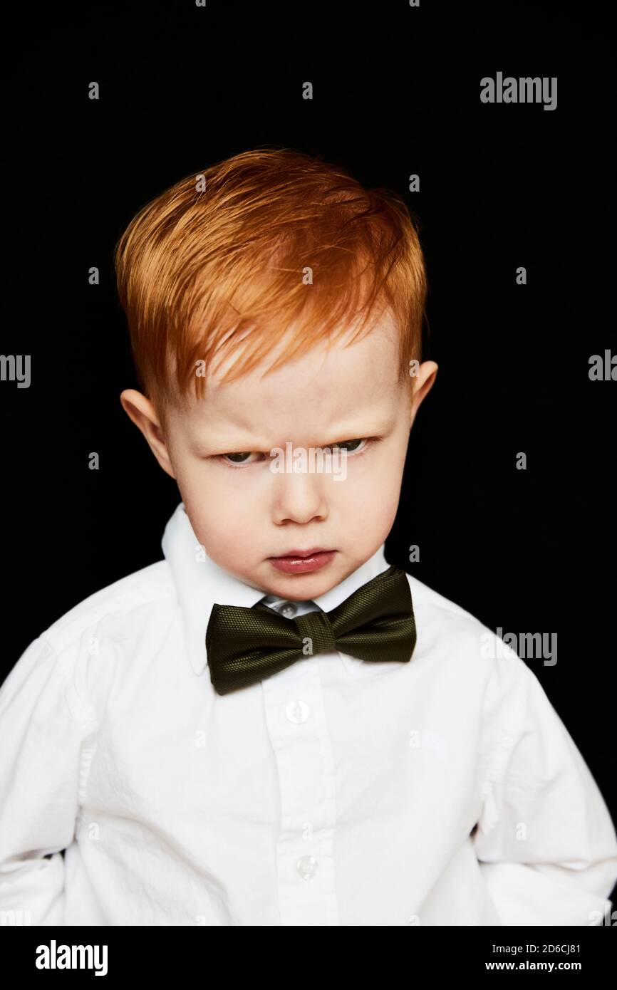 Portrait of boy making angry face Stock Photo - Alamy