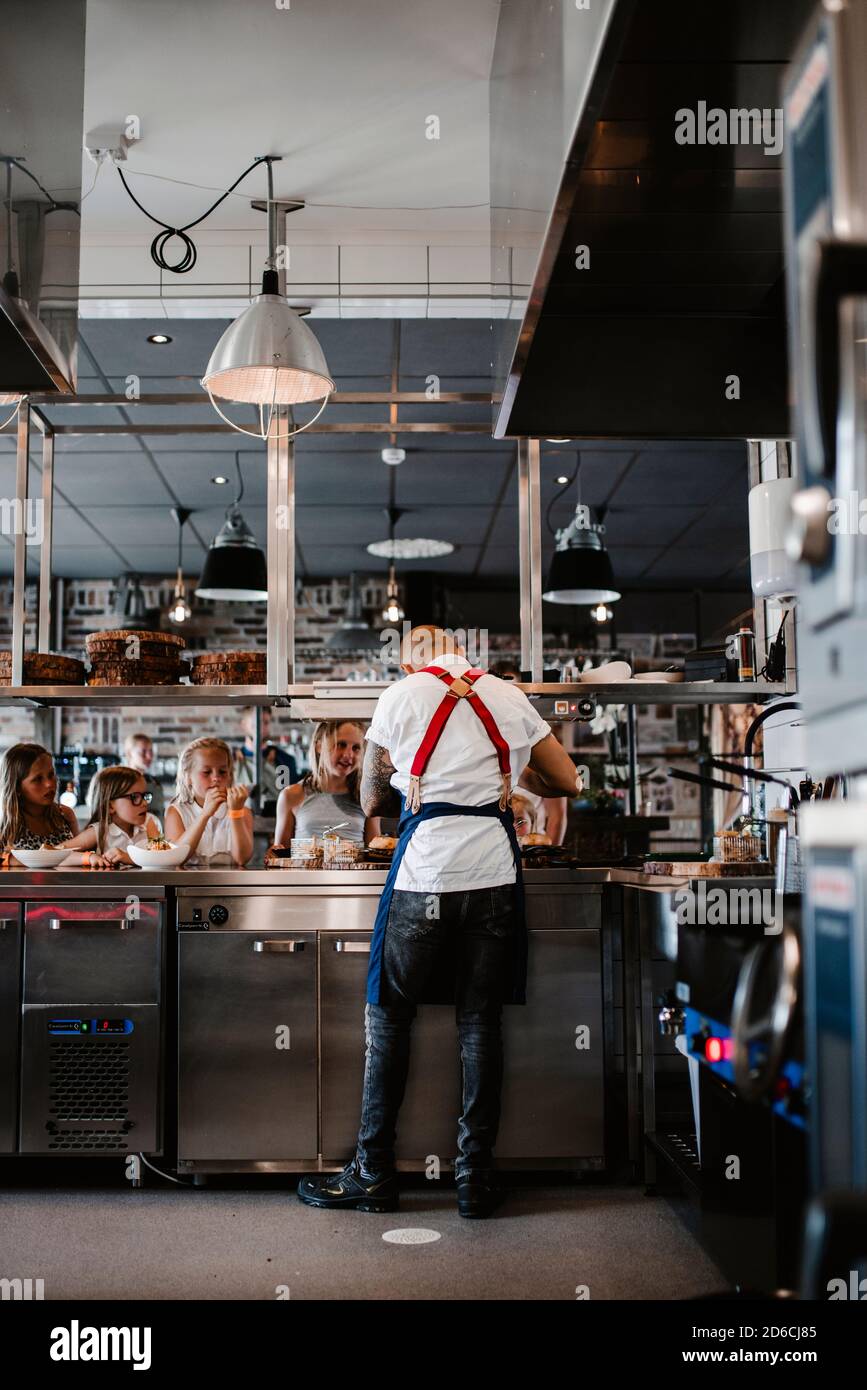 Chef working in restaurant kitchen Stock Photo - Alamy