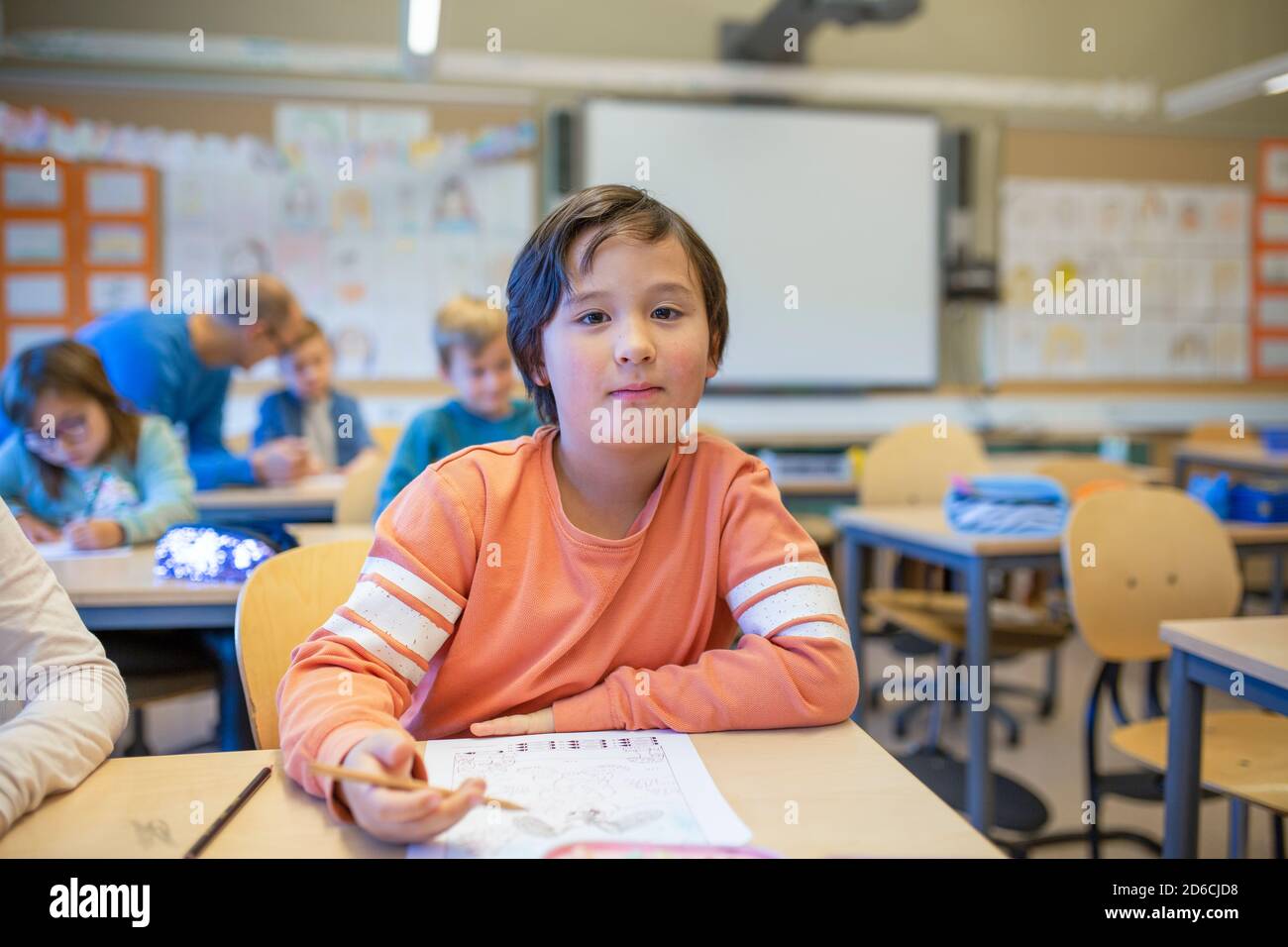 Boy in classroom Stock Photo - Alamy