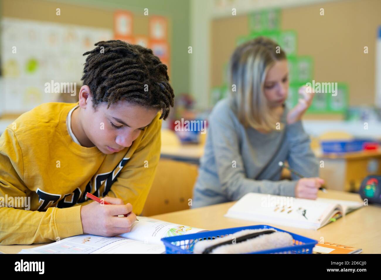 Boy in classroom Stock Photo - Alamy