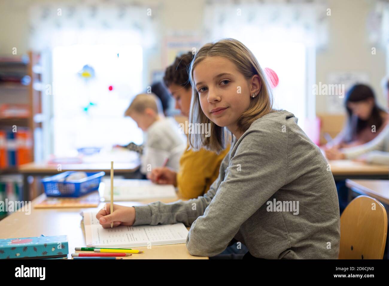 Girl in classroom Stock Photo - Alamy