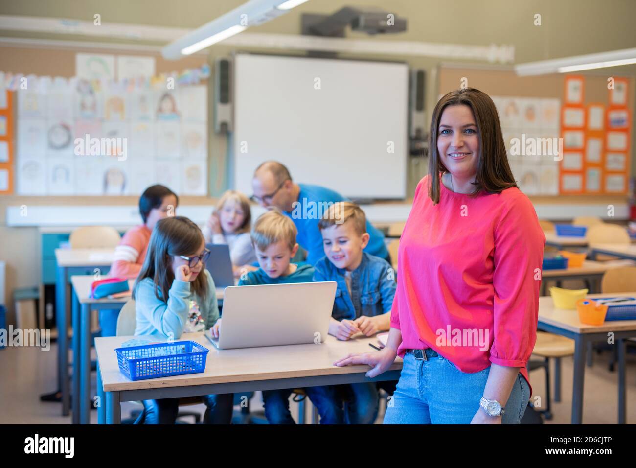 Teacher in classroom Stock Photo - Alamy