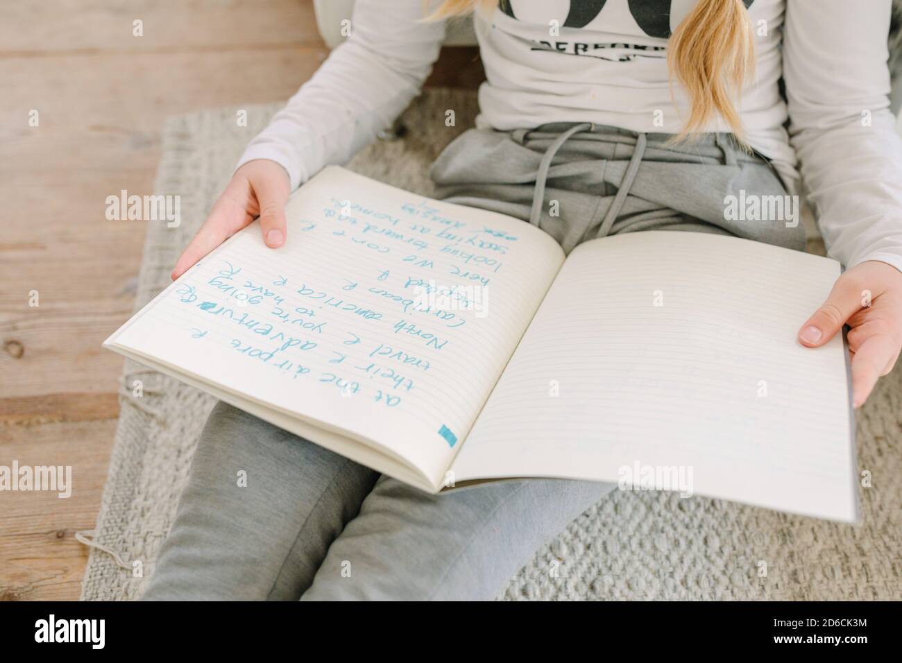 Girl holding notebook Stock Photo - Alamy