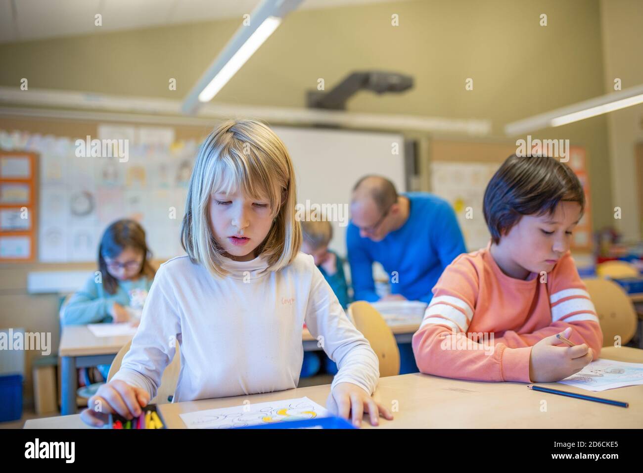 Girl in classroom Stock Photo - Alamy