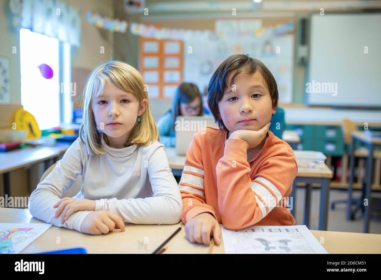 Boy and girl in classroom Stock Photo - Alamy
