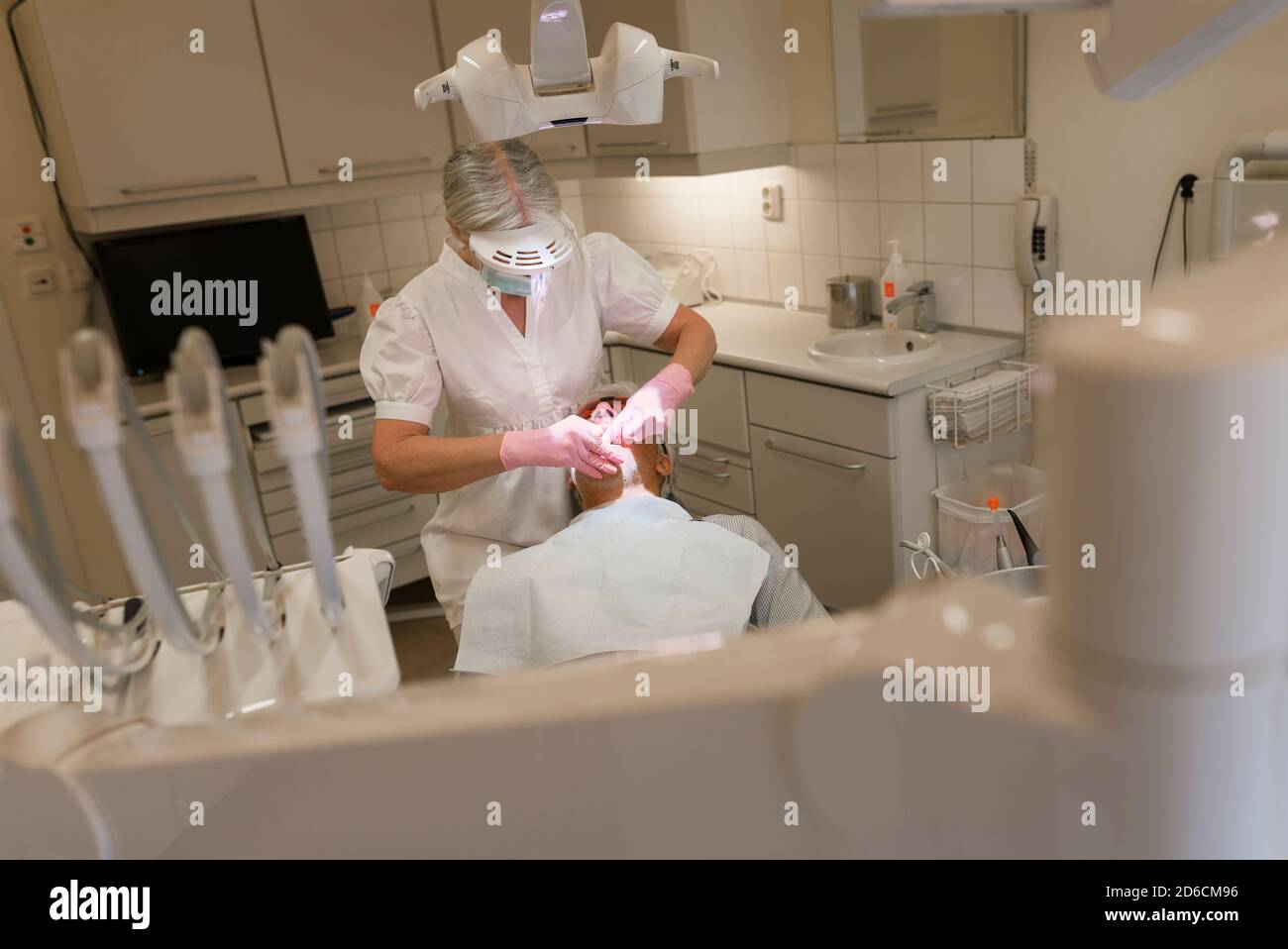 Dentist examining patients teeth Stock Photo - Alamy