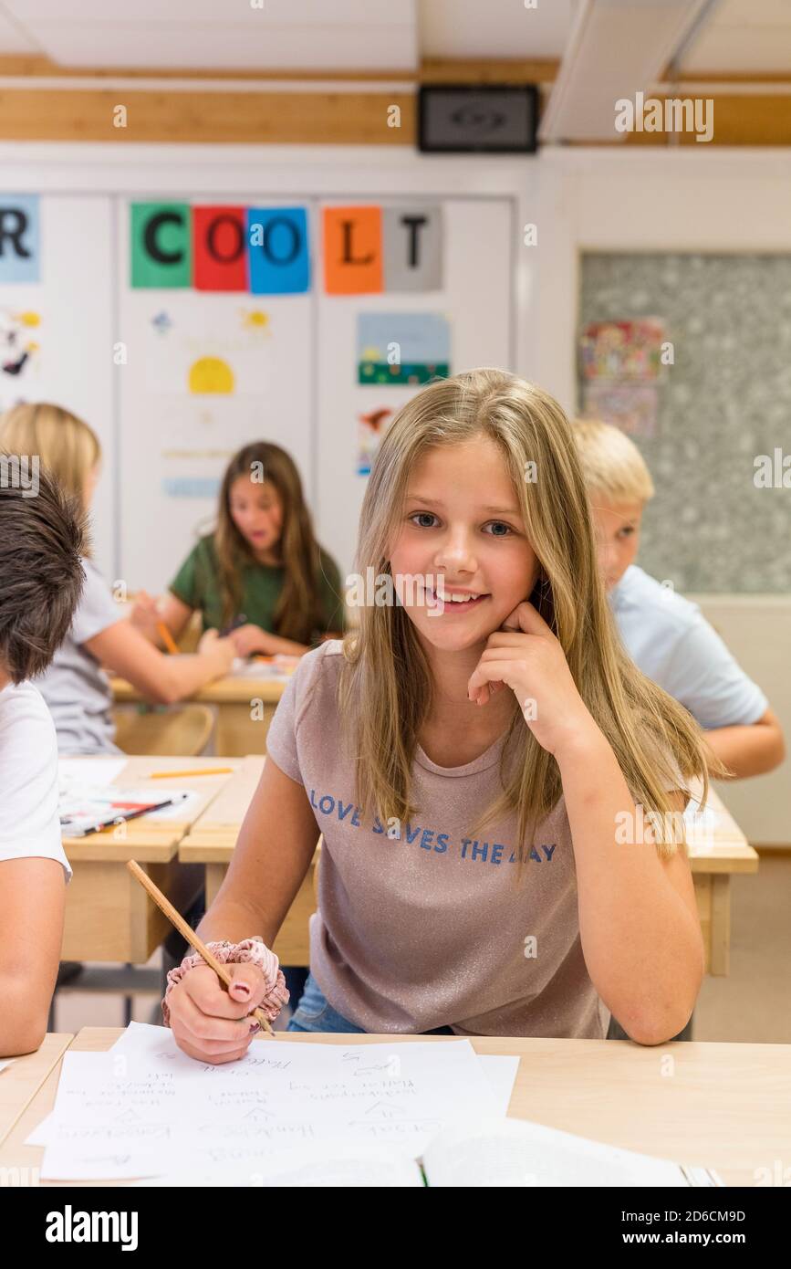 Girl in classroom Stock Photo - Alamy