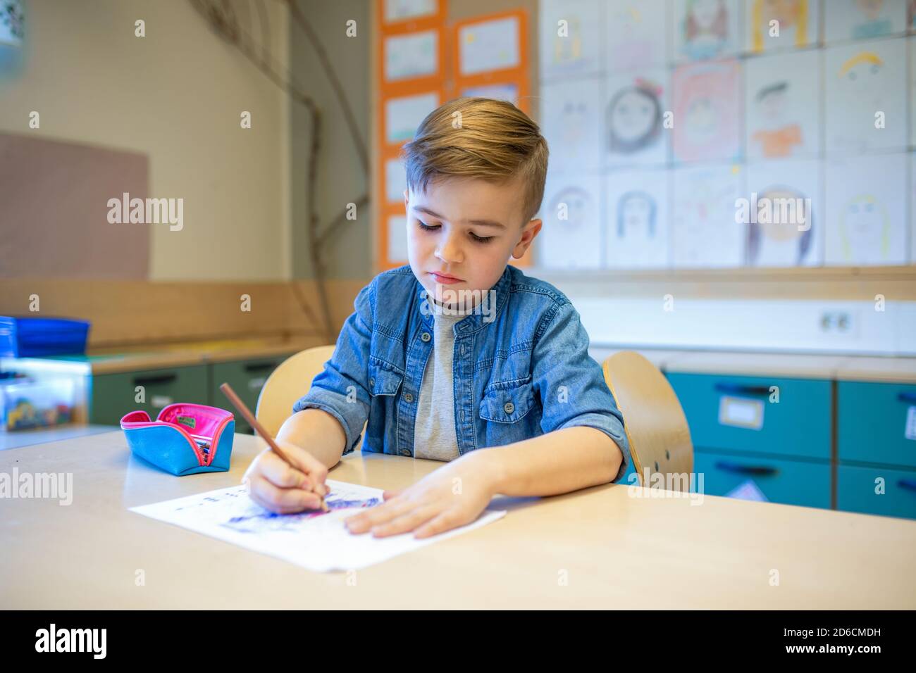 Boy in classroom Stock Photo - Alamy