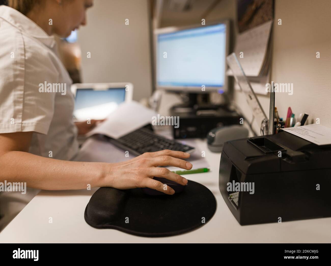 Dentist using computer in surgery Stock Photo - Alamy