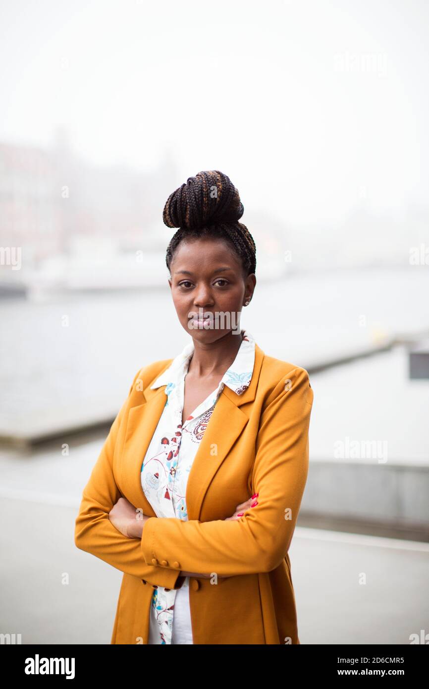 Woman looking at camera Stock Photo - Alamy