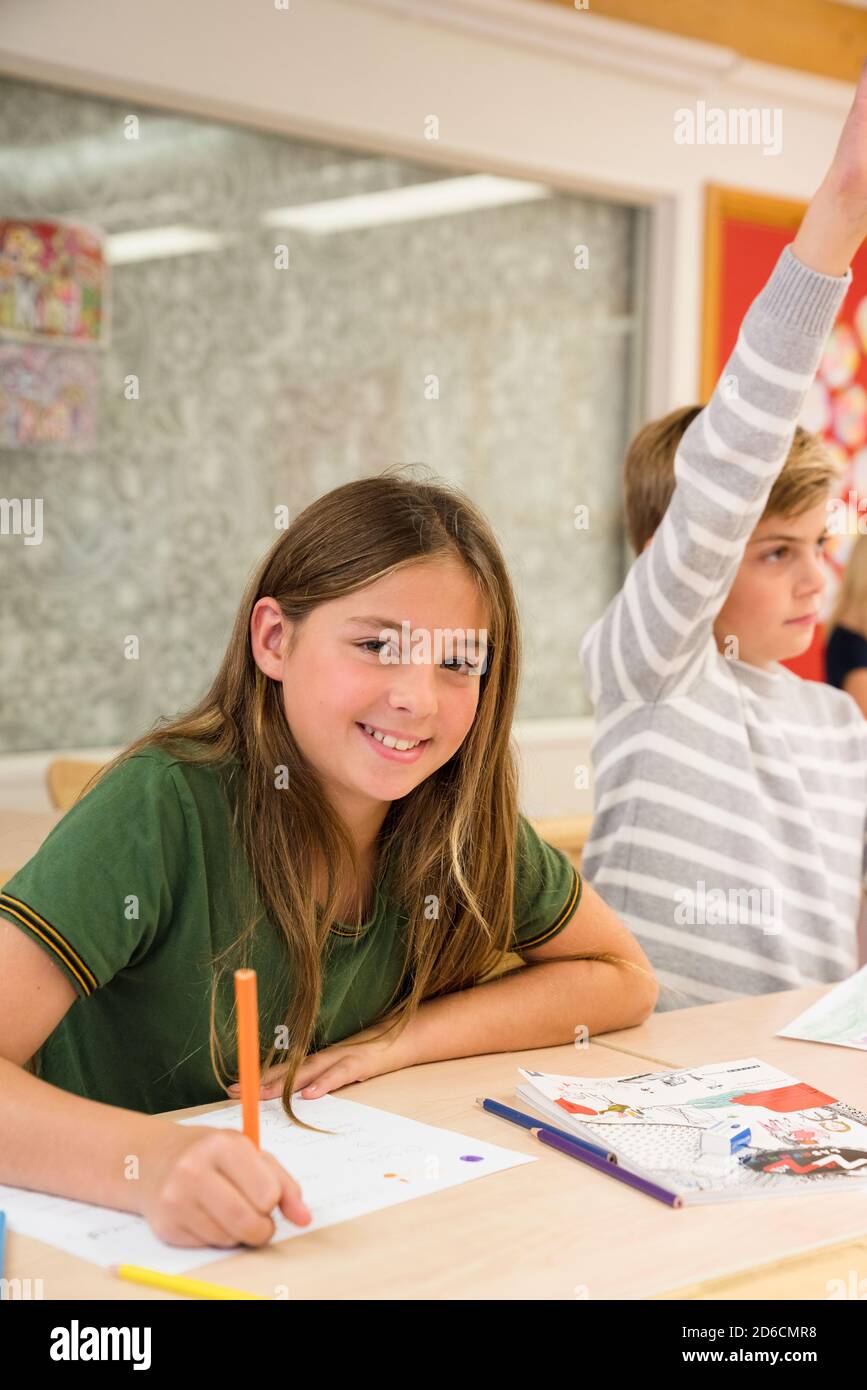 Girl in classroom Stock Photo - Alamy