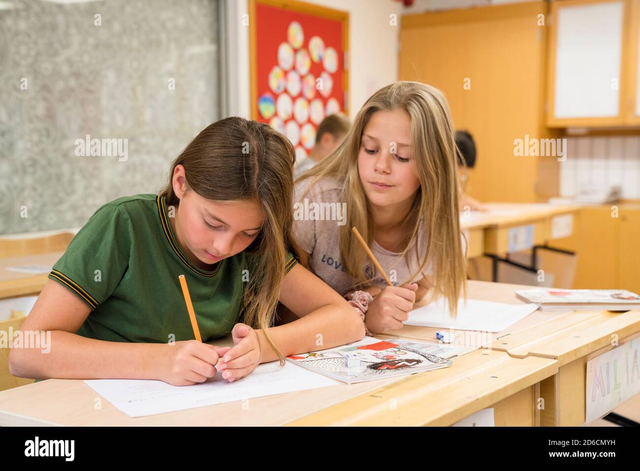 Girls in classroom Stock Photo - Alamy