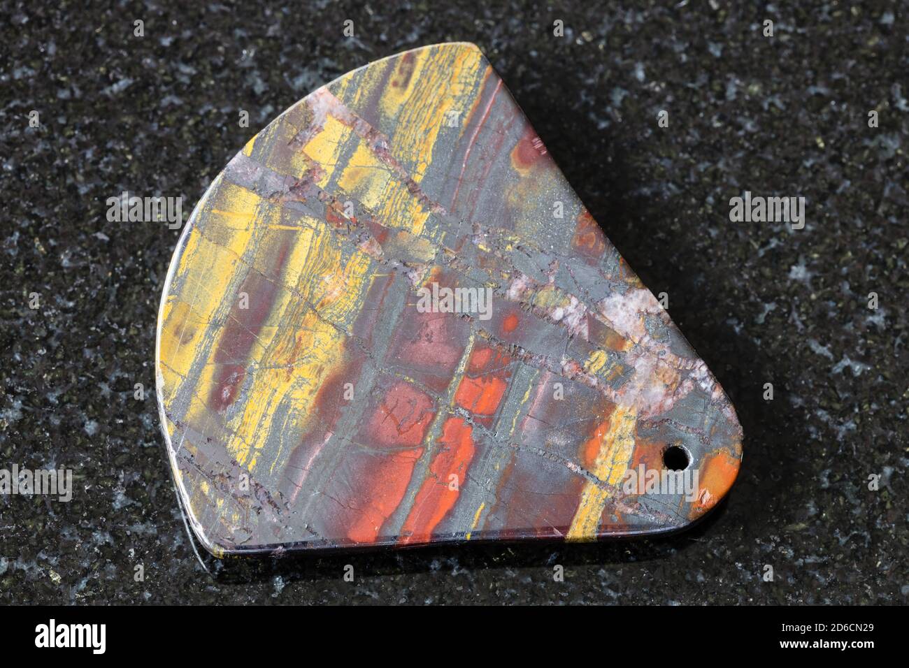 pendant from polished Jaspillite (Jaspilite) stone on black granite ...