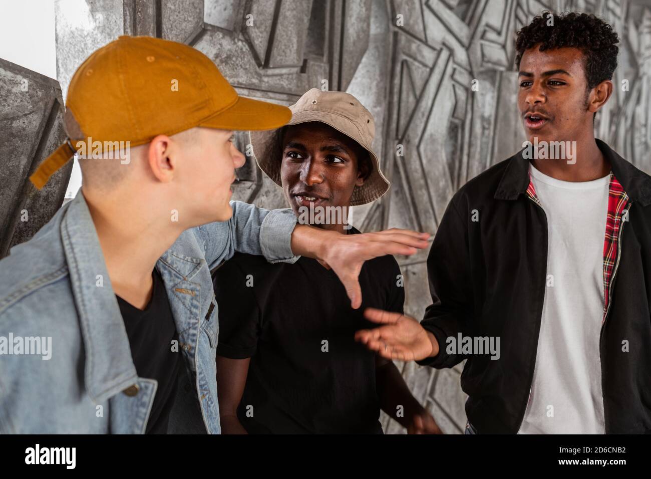 Friends talking together Stock Photo - Alamy