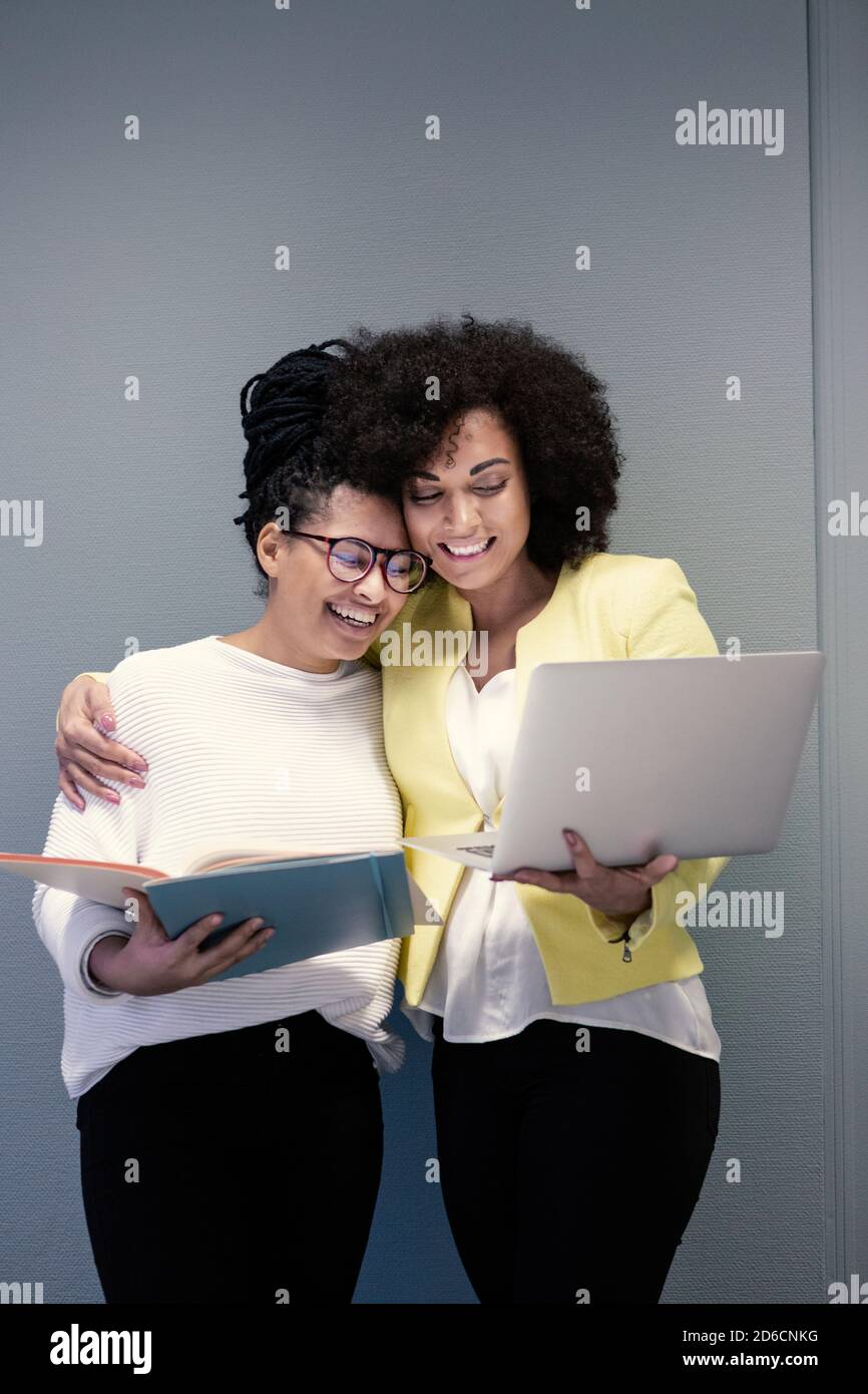 Happy coworkers together Stock Photo - Alamy
