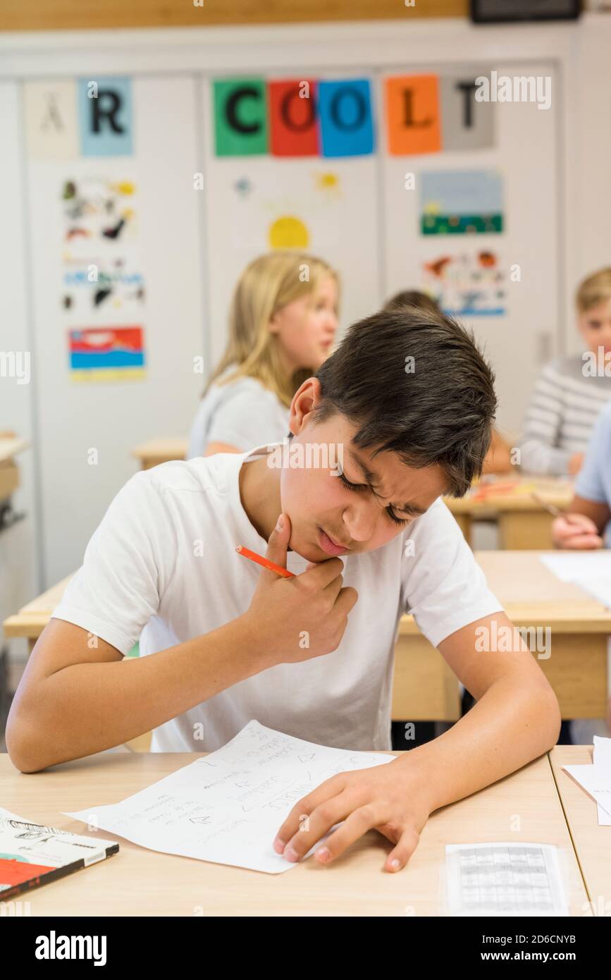 Boy in classroom Stock Photo - Alamy