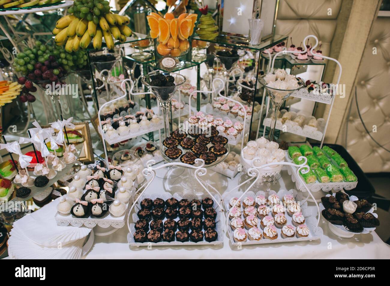 Various colored delicious sweets in a candy bar at a wedding. Sweet ...