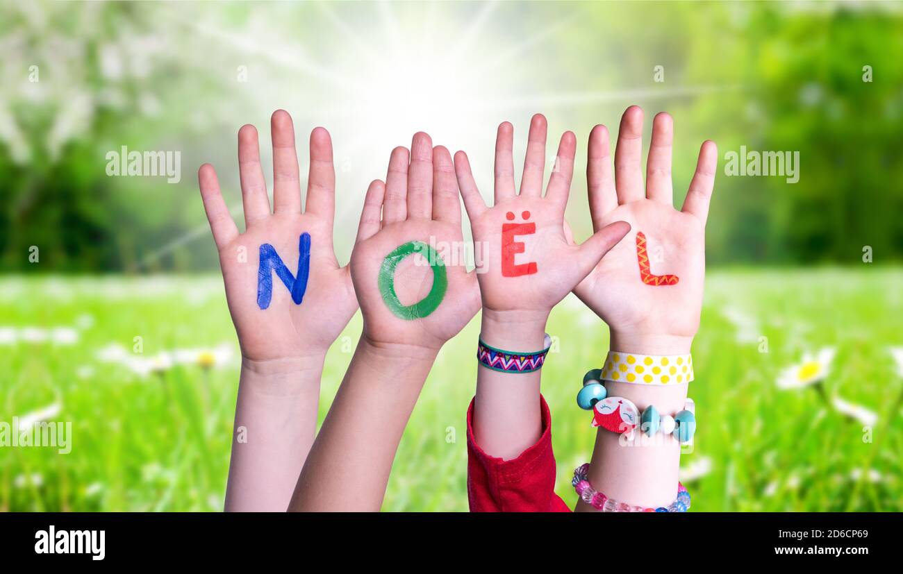 Children Hands Building Word Noel Means Christmas, Grass Meadow Stock ...