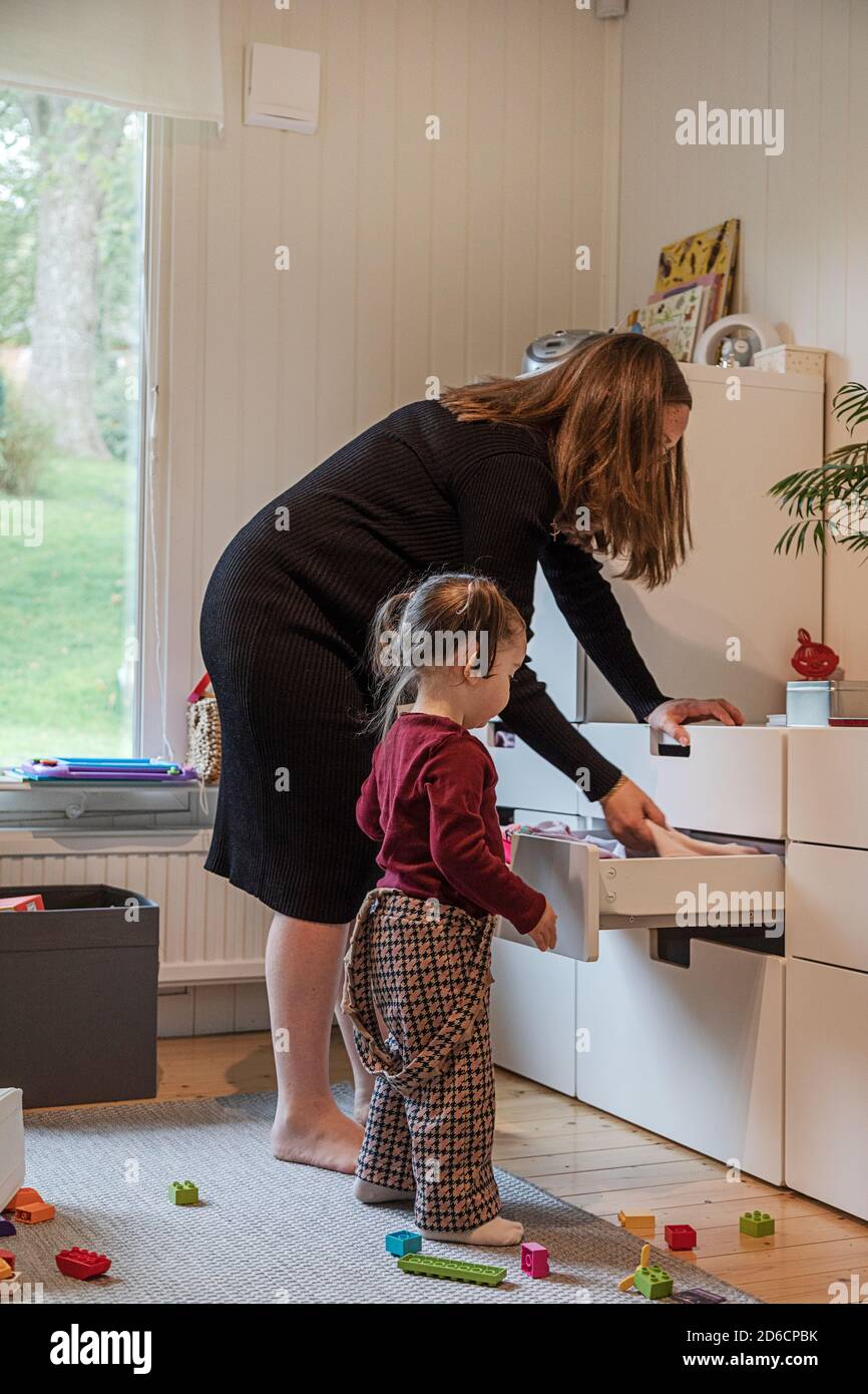 Mother with daughter at home Stock Photo - Alamy