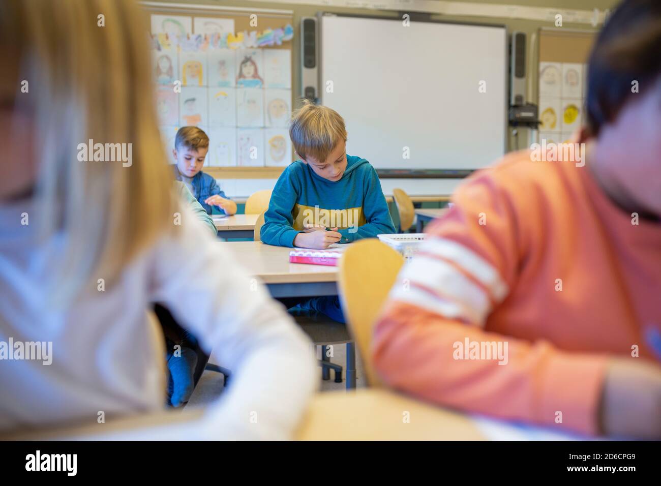 Two school boys working classroom desk hi-res stock photography and ...