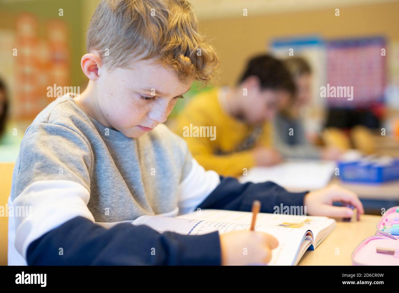 Boy in classroom Stock Photo - Alamy