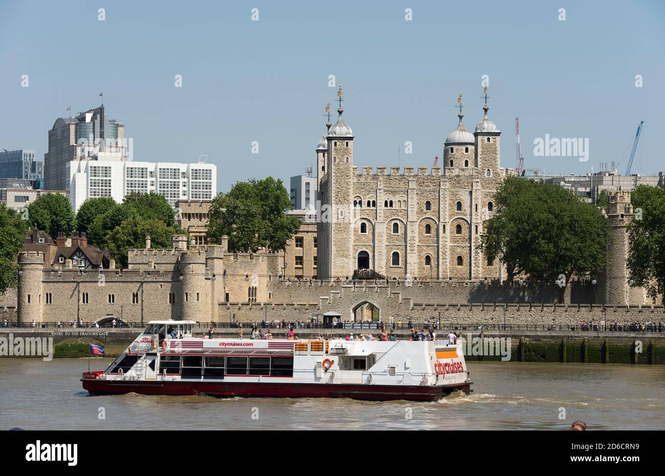 River cruise boat passing the Tower of london on the River Thames in ...