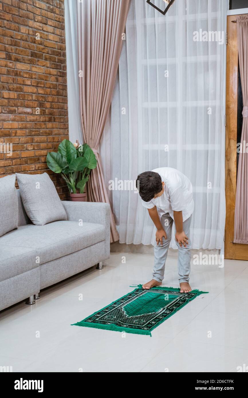 Little Muslim kid worships and prays for Allah Stock Photo - Alamy