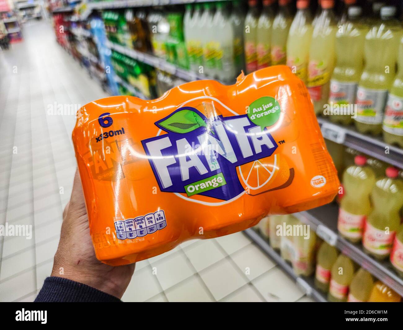 Puilboreau, France - October 14, 2020:Closeup of Man hand buying Fanta ...