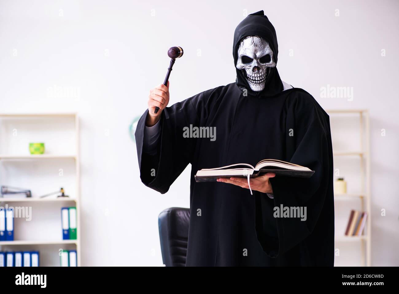 Devil judge working in the courthouse Stock Photo - Alamy