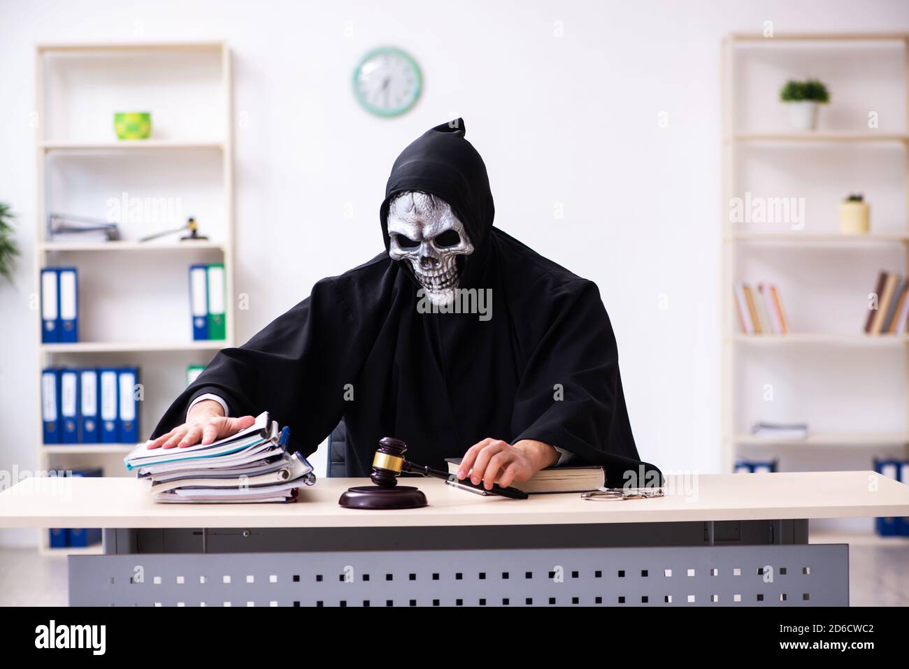 Devil judge working in the courthouse Stock Photo - Alamy