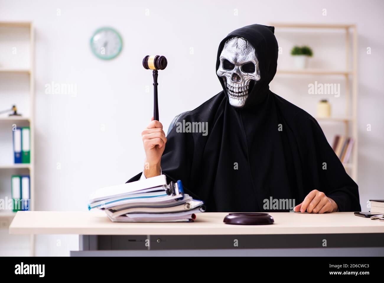 Devil judge working in the courthouse Stock Photo - Alamy