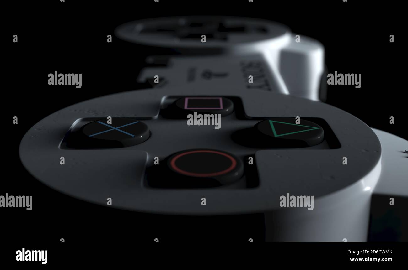 A classic original sony playstation one gaming controller in dark moody ...