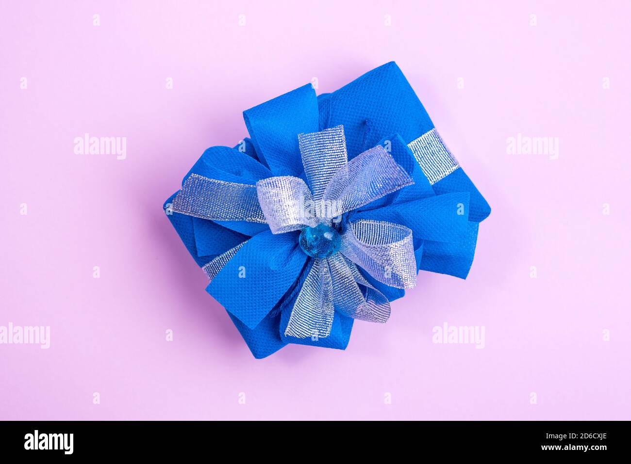 Classic blue surprise gift box with blue and white ribbon, background ...