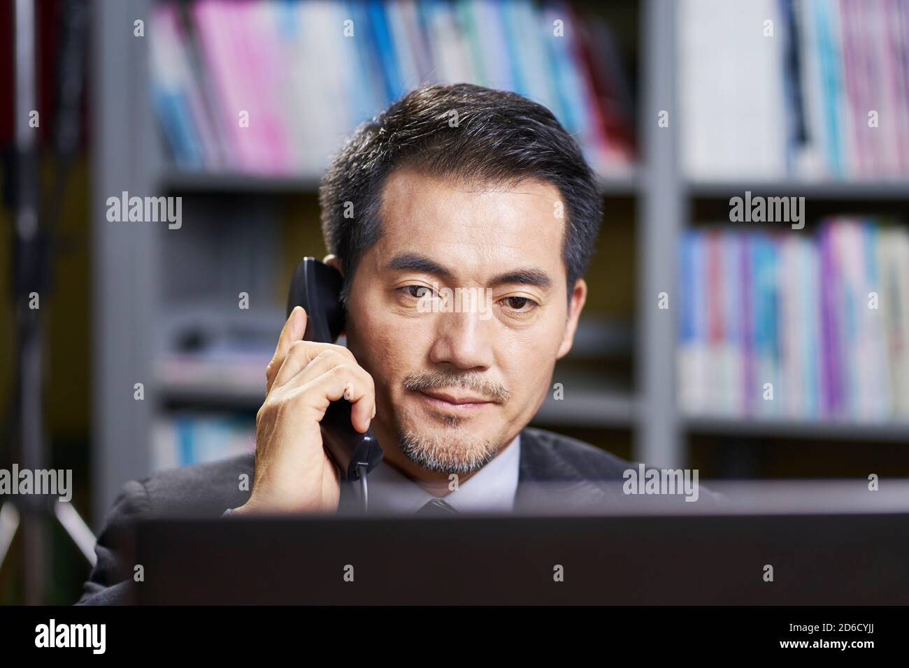Male talking on phone desk hi-res stock photography and images - Alamy