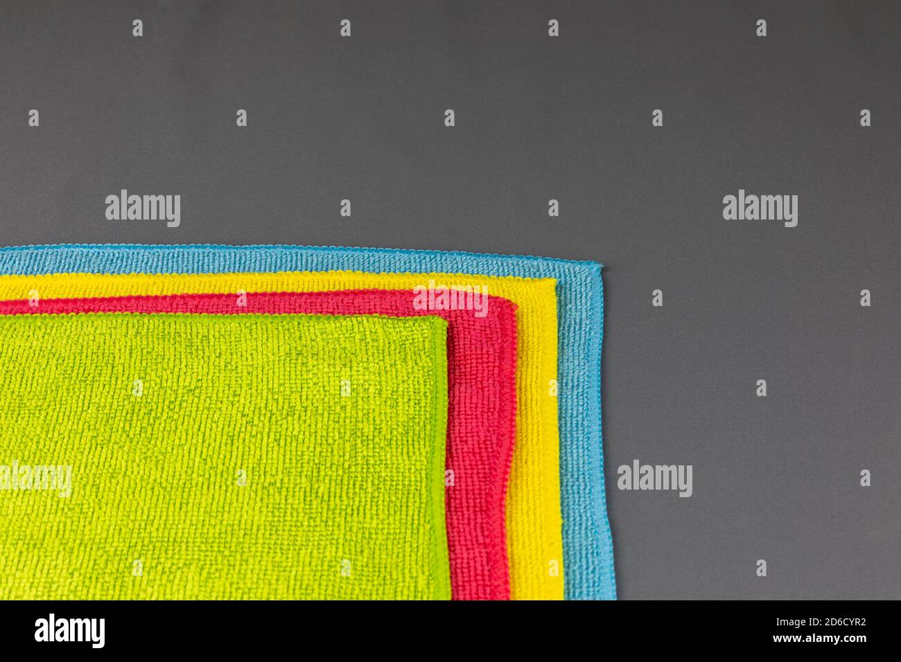 Colored microfiber cloth on gray background Stock Photo - Alamy