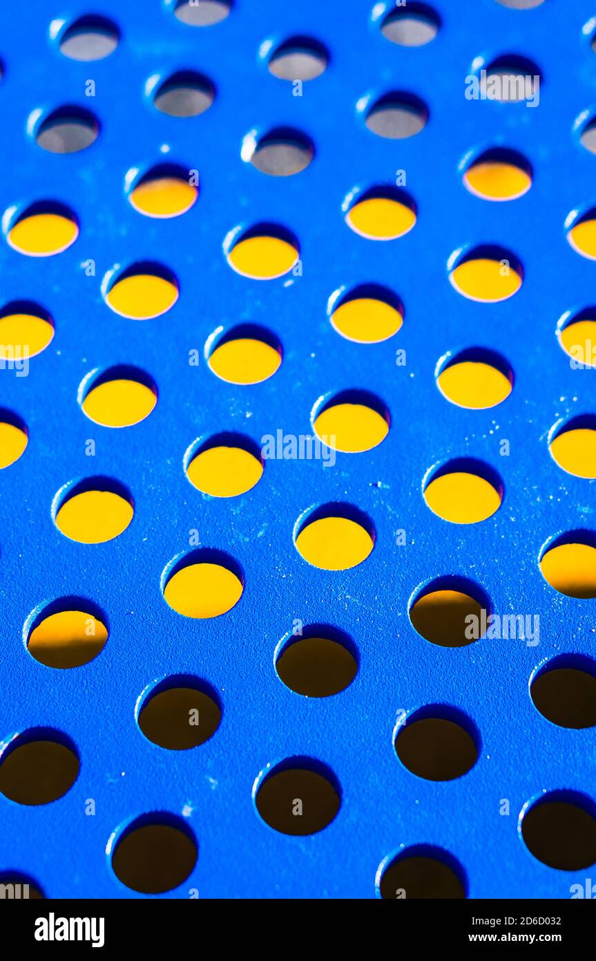 Blue plastic background with holes Stock Photo - Alamy